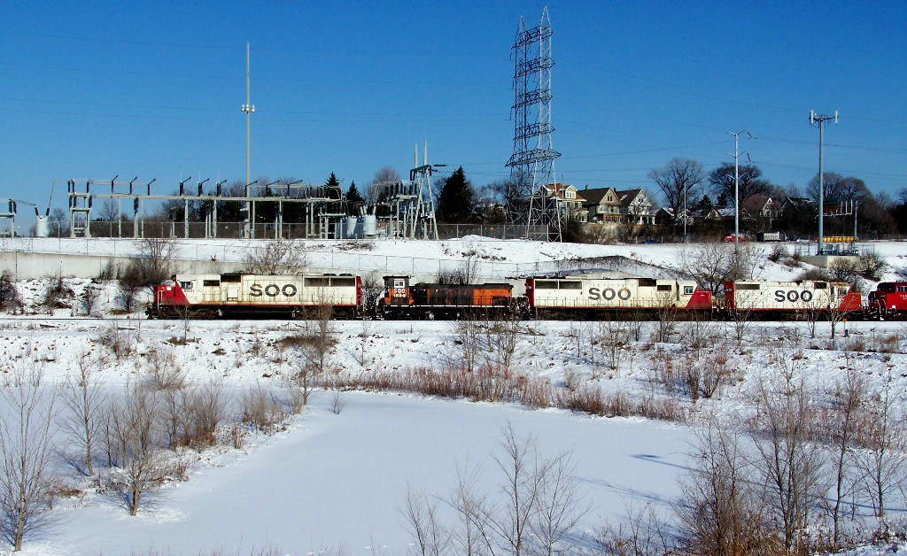 Westbound Soo 6021 and pals approach the Grand Avenue curve